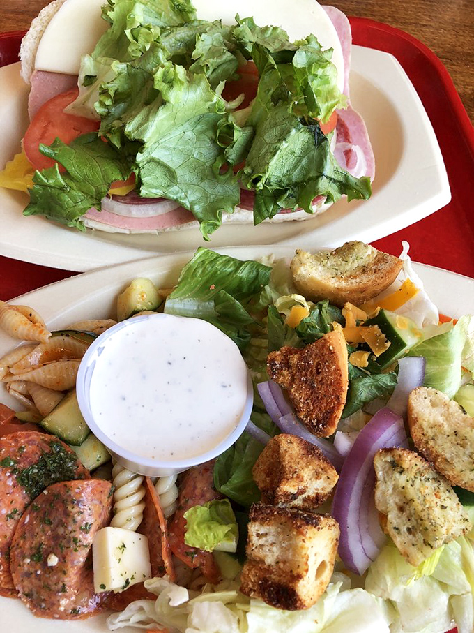 A sandwich built like a skyscraper and a salad that didn't get the memo about being boring. Lunch that makes you rethink going back to work.