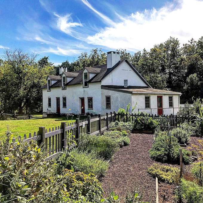 This whitewashed farmhouse with its kitchen garden tells the story of simpler times without saying a word.