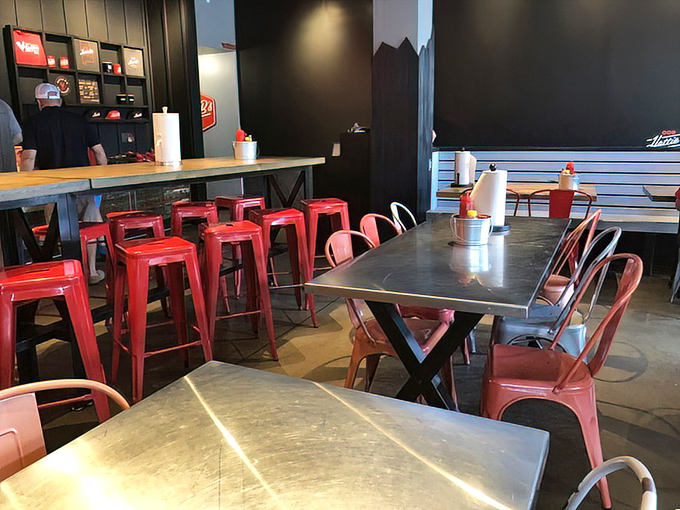 Industrial meets inviting with metal chairs and wooden tables&mdash;the perfect backdrop for the spice drama about to unfold.