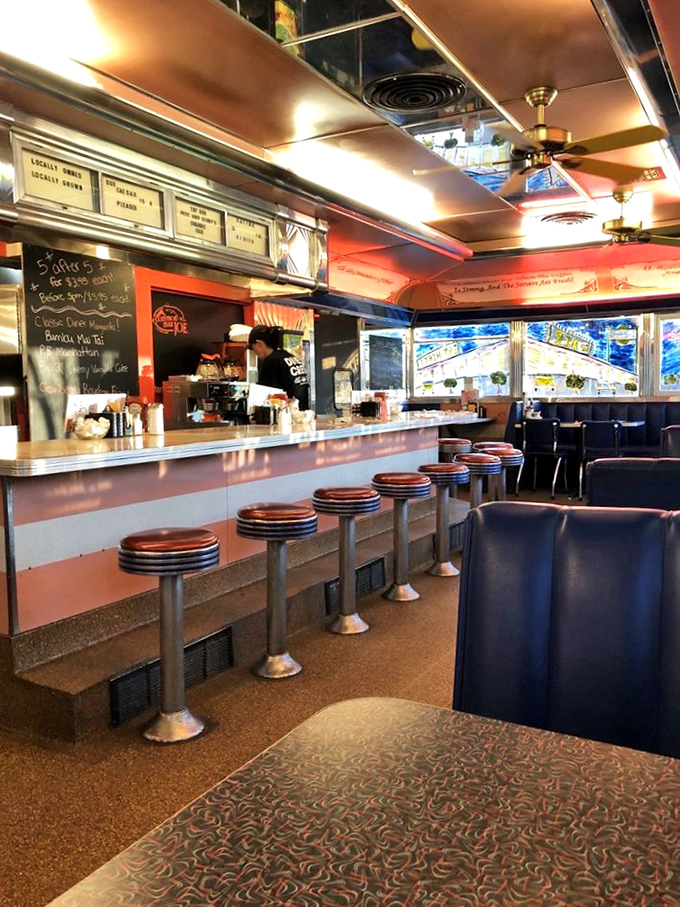 The counter view&mdash;where coffee steam rises, orders fly, and the rhythmic scrape of spatula on grill creates the soundtrack of comfort.