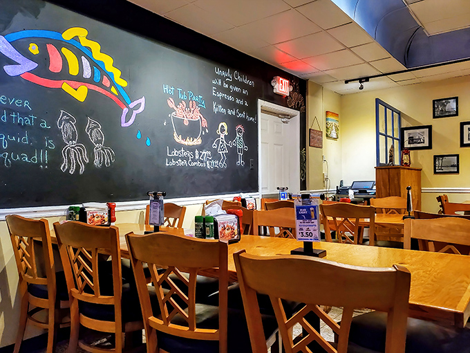 Colorful fish drawings on the chalkboard wall add whimsy to the dining experience. Even the squid doodle seems to be saying, "Try the calamari!