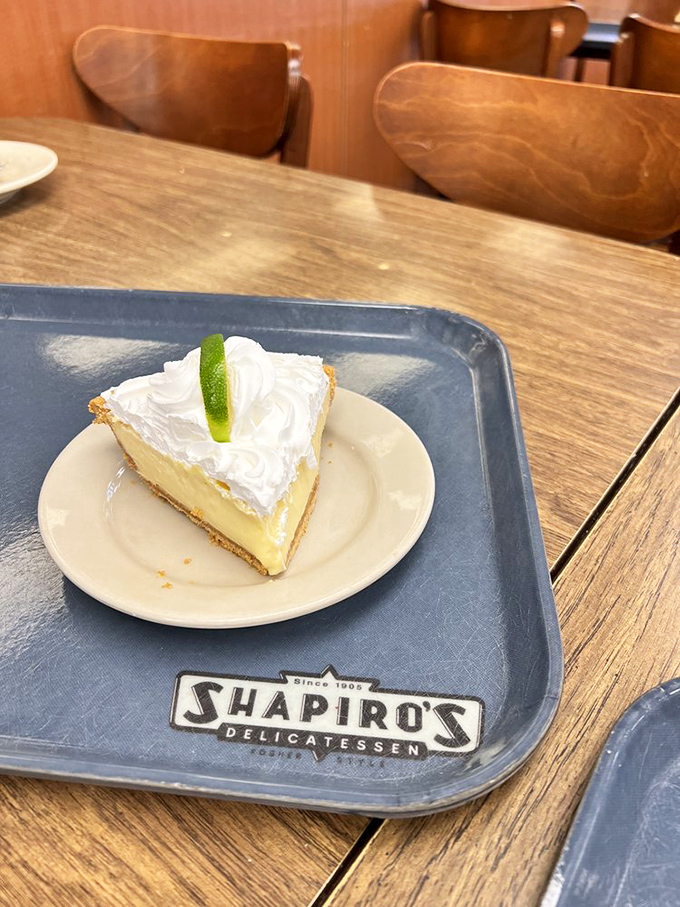 Key lime pie that hits that perfect sweet-tart balance, topped with a cloud of whipped cream and a lime slice that says, "Yes, I am the real deal."