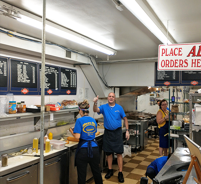 Behind the scenes magic – where sandwich construction becomes an art form under the watchful eye of experienced hands.