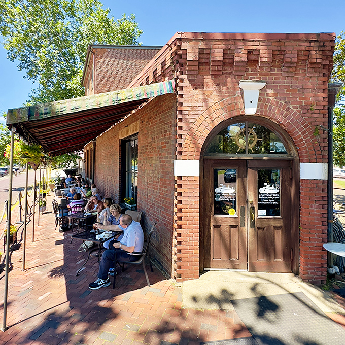 The Levee House Bistro's brick patio proves some of life's best moments happen over coffee at tables that wobble just slightly.