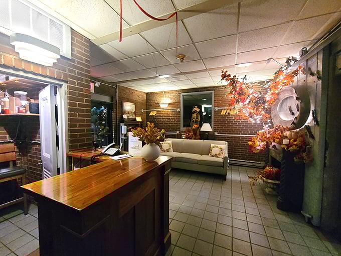 The welcoming entrance area offers a cozy prelude to the dining experience, with warm wood and seasonal touches.