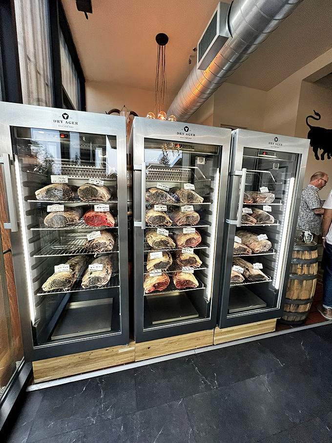 Dry-aging display cases showing serious commitment to beef perfection that would impress any meat connoisseur.