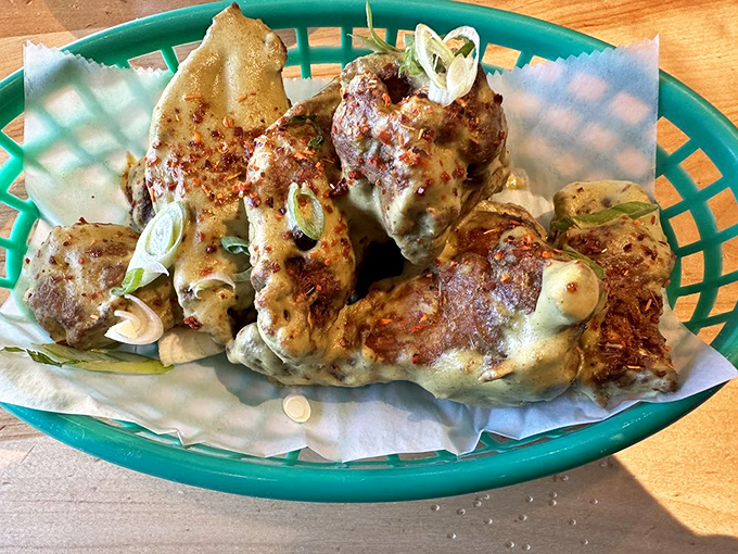 Wings that flew too close to the mole verde sun and are all the better for it. Crispy, saucy perfection topped with scallions.