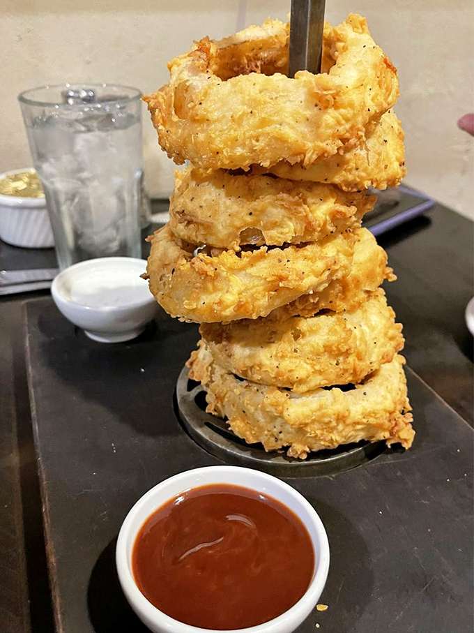 These aren't just onion rings&mdash;they're golden halos stacked like a savory Jenga tower, waiting to collapse into delicious chaos.