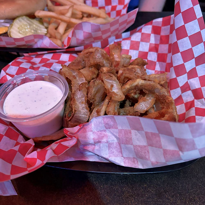 Onion rings that deserve their own fan club. Crispy, golden halos of happiness served with dipping sauce for maximum enjoyment.