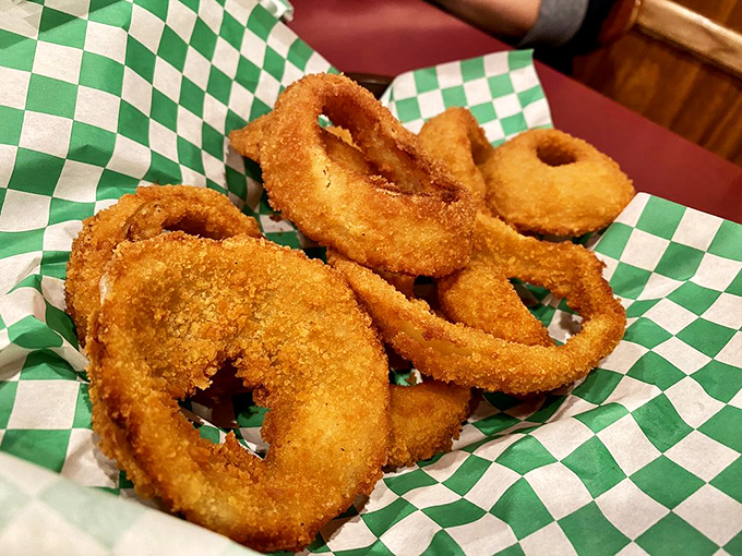 These aren't just onion rings&mdash;they're golden halos of happiness, perfectly crisp and ready to complement your burger adventure.
