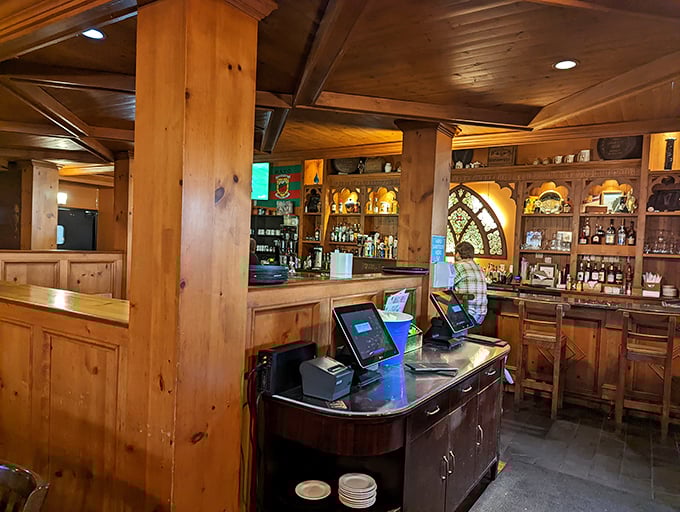 Warm wood tones and cathedral-inspired arches frame the ordering area, where Irish spirits and hospitality flow in equal measure.