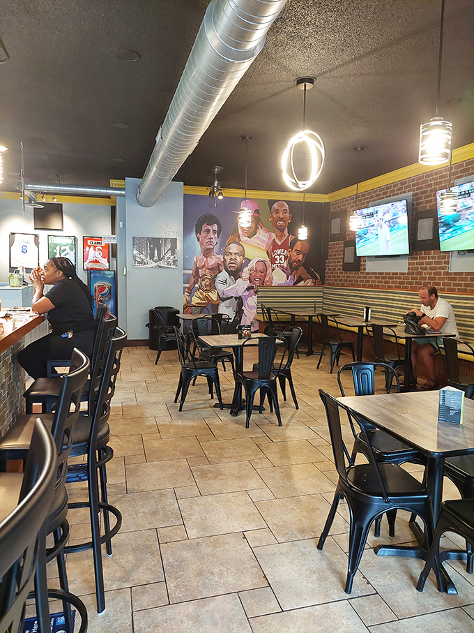 Sports legends watch over diners from that mural, silently approving your decision to order extra cheese. The atmosphere is pure Philly-meets-Ohio magic.