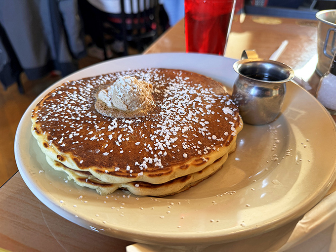 Pancakes so perfectly golden they deserve their own Instagram account. That dollop of butter slowly melting is pure breakfast theater.