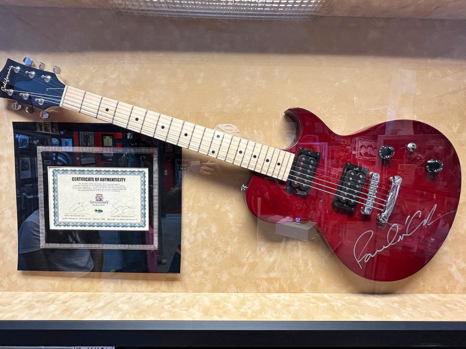 That cherry-red Gibson isn't just any guitar&mdash;it bears Paul McCartney's signature. Some instruments make music; this one made history.