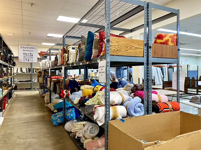 Blankets and pillows stack like colorful layers of comfort cake, ready to transform any house into a cozy home.