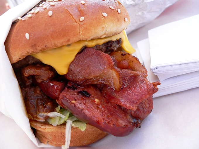 A bacon cheeseburger so loaded it practically requires a construction permit and structural engineering degree to consume.