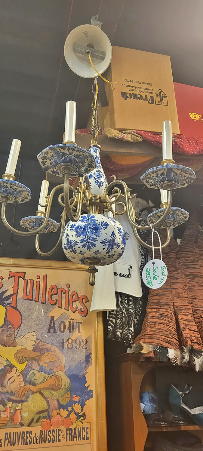 Delft-inspired porcelain meets brass in this stunning chandelier&mdash;proof that lighting fixtures were once considered functional art rather than mere utilities.