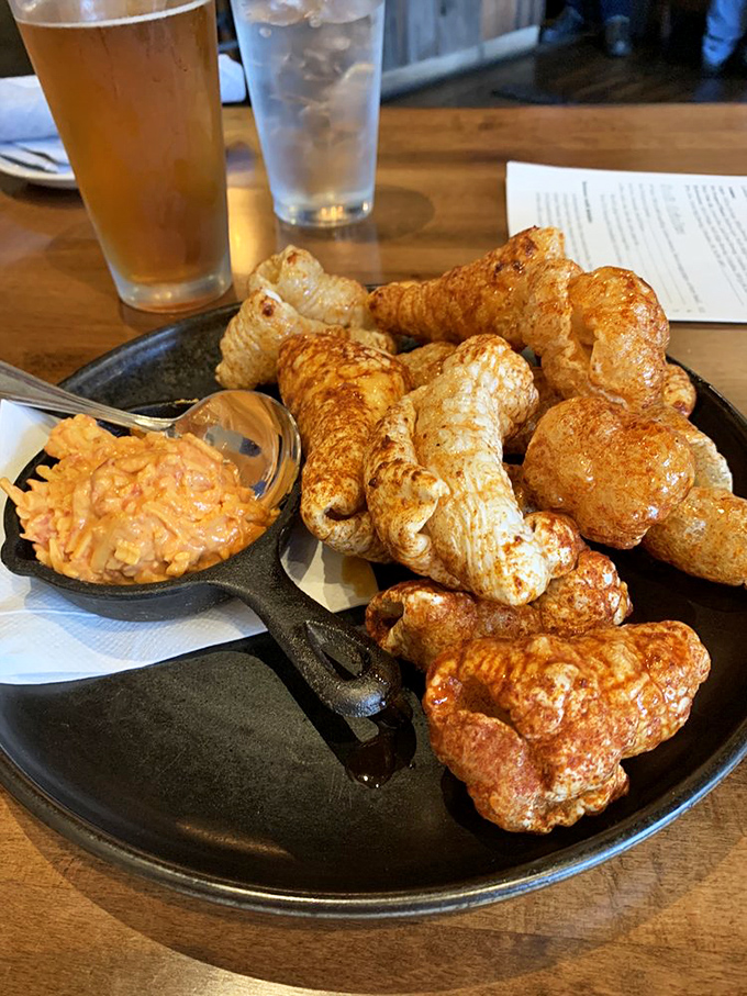 Pork rinds reimagined&mdash;crispy, airy clouds of porky goodness with a side of pimento cheese that demands to be slathered generously.