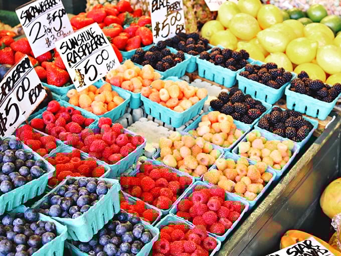 The farmers market's berry bounty showcases nature's candy store, where the only difficult choice is whether to eat them now or pretend you'll make something fancy later.
