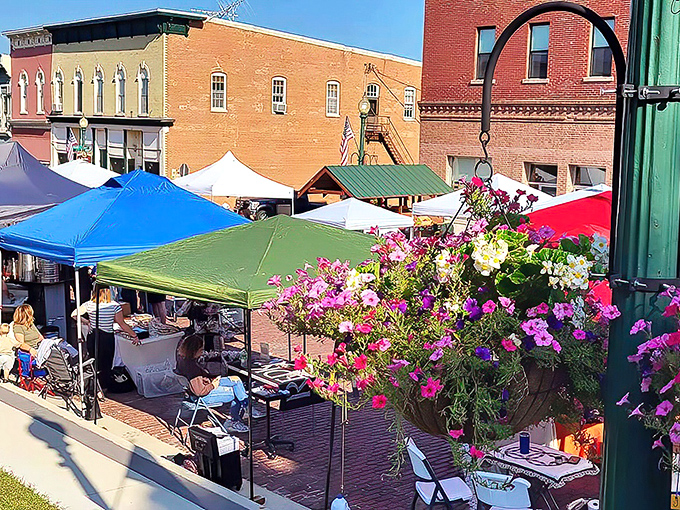 The farmers market transforms brick streets into a canvas of color&mdash;where conversations flow as freely as the coffee at the corner caf&eacute;.