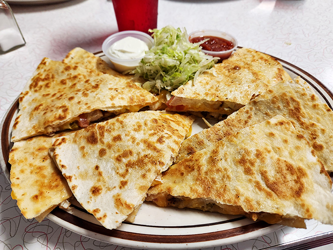 A quesadilla that doesn't need a passport to deliver authentic flavor. Crispy, gooey, and ready for its close-up on your Instagram.