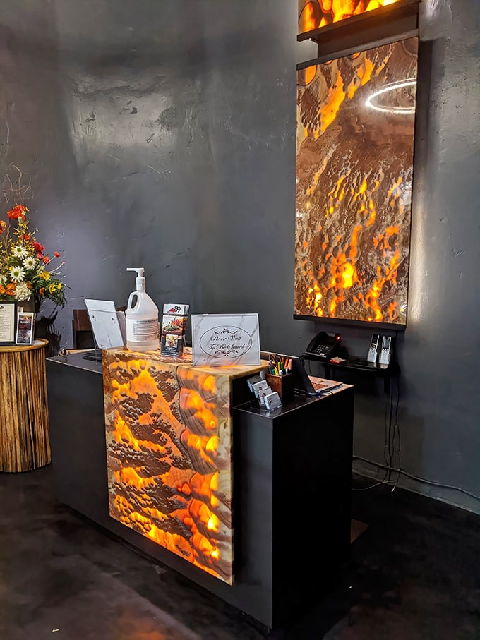 The host station's dramatic flame imagery promises the fire-kissed flavors waiting inside this culinary temple.