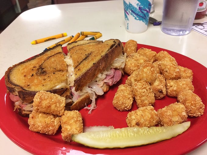 A Reuben sandwich that's been working out&mdash;thick, proud, and accompanied by tater tots that refused to grow up into full potatoes.
