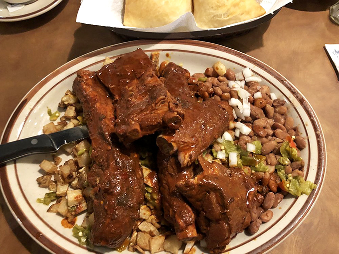 These ribs haven't just been cooked&mdash;they've been coaxed into tender submission by red chile that means serious business.