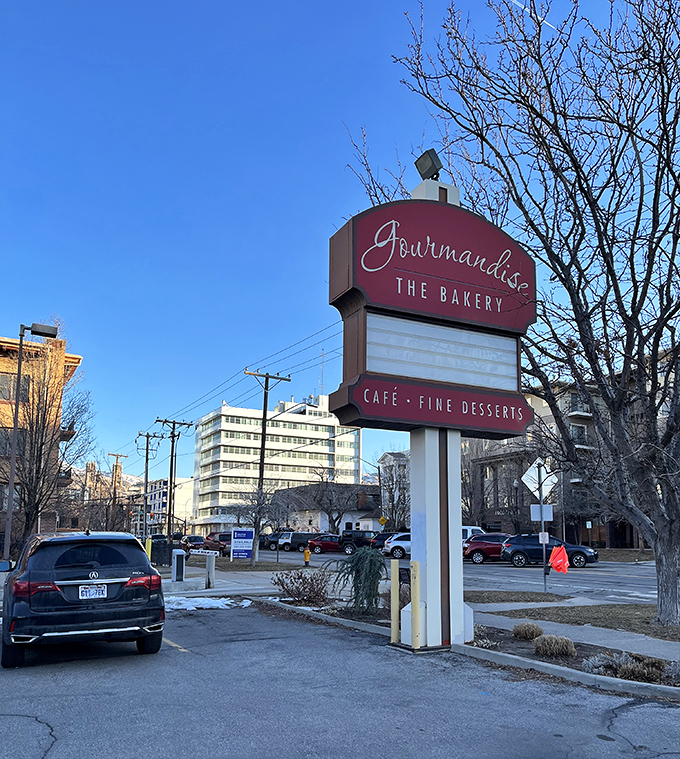 The vintage-style sign stands like a beacon of hope for the dessert-deprived, promising "CAF&Eacute; &bull; FINE DESSERTS" to all who approach.