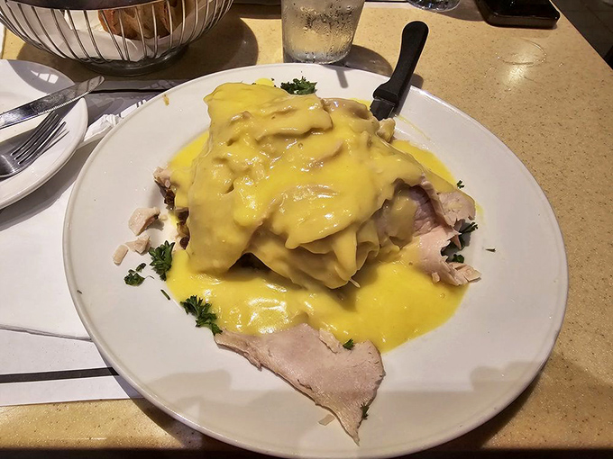 Turkey dinner that makes Thanksgiving jealous, smothered in sunshine-yellow hollandaise. This isn't just poultry&mdash;it's a celebration on a plate.