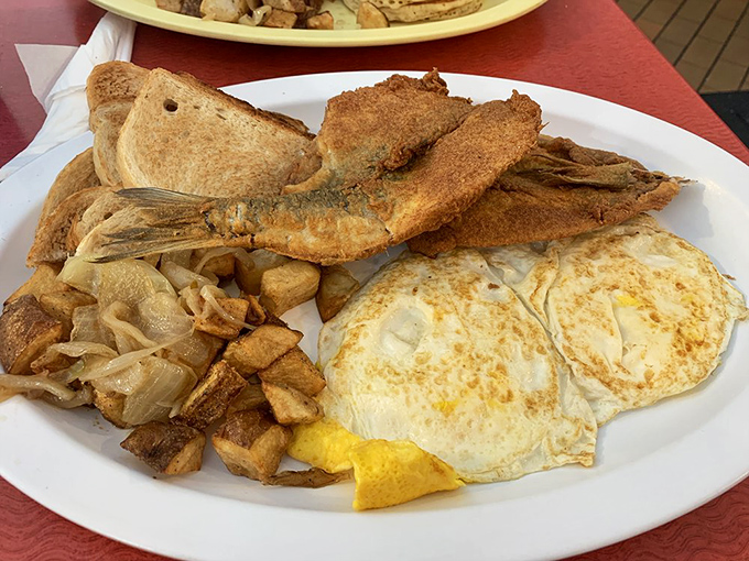 This isn't just breakfast &ndash; it's a morning feast with perfectly fried fish and eggs sunny enough to brighten any day.