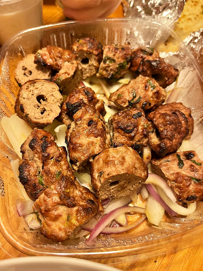 Seekh kabab&mdash;where ground meat meets fire and spice in a relationship that was clearly meant to be. Charred perfection.