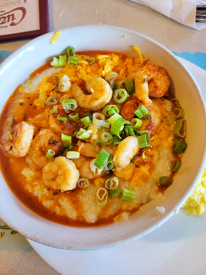 Shrimp and grits that would make a Southerner weep with joy – creamy, savory, and topped with enough green onions to make it count as a vegetable.