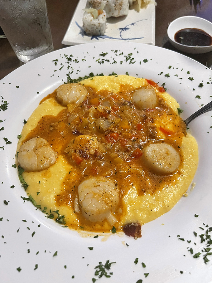 These shrimp and grits elevate comfort food to an art form. The plump shrimp nestled in creamy yellow grits look like sunshine on a plate.