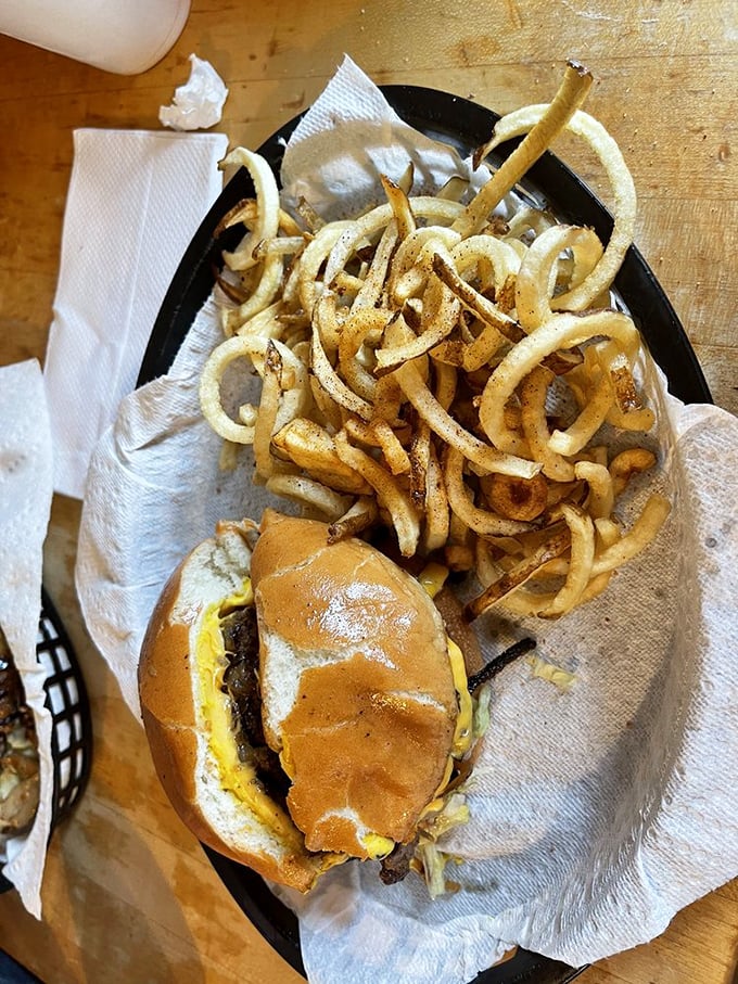 A basket of joy. The curly fries form a golden nest around the burger, like nature intended. Simplicity elevated to art.
