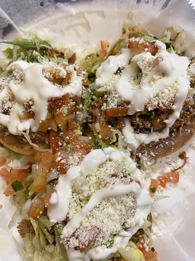 These sopes are like tiny edible stadiums where the all-star ingredients play the most delicious game you've ever witnessed.