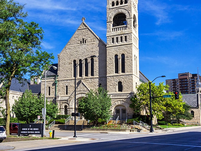 St. Ambrose Cathedral's stone tower reaches skyward, a spiritual landmark that's been photobombing downtown selfies for generations.