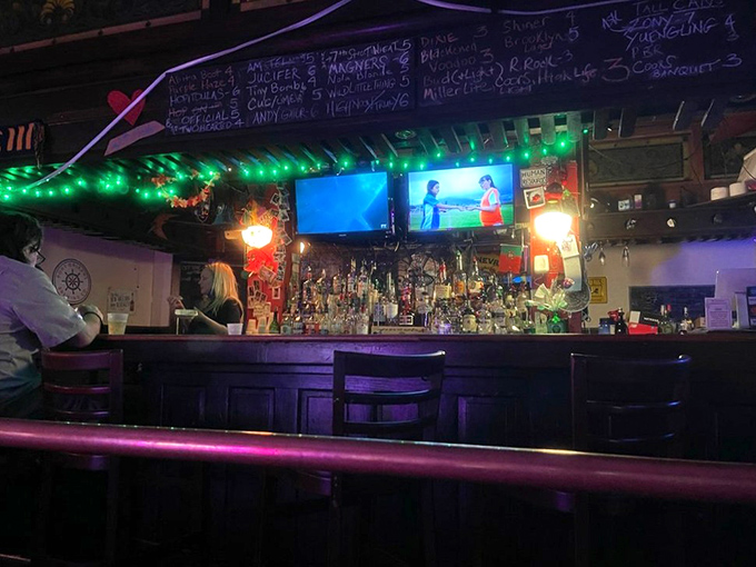 The bar glows with possibility under strings of green lights. This isn't just where drinks are served; it's where neighborhood legends are born.