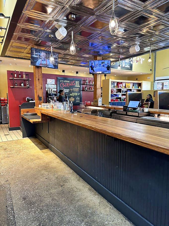 The bar area doesn't just serve drinks&mdash;it promises morning cocktails that make "hair of the dog" seem like sophisticated self-care rather than damage control. 