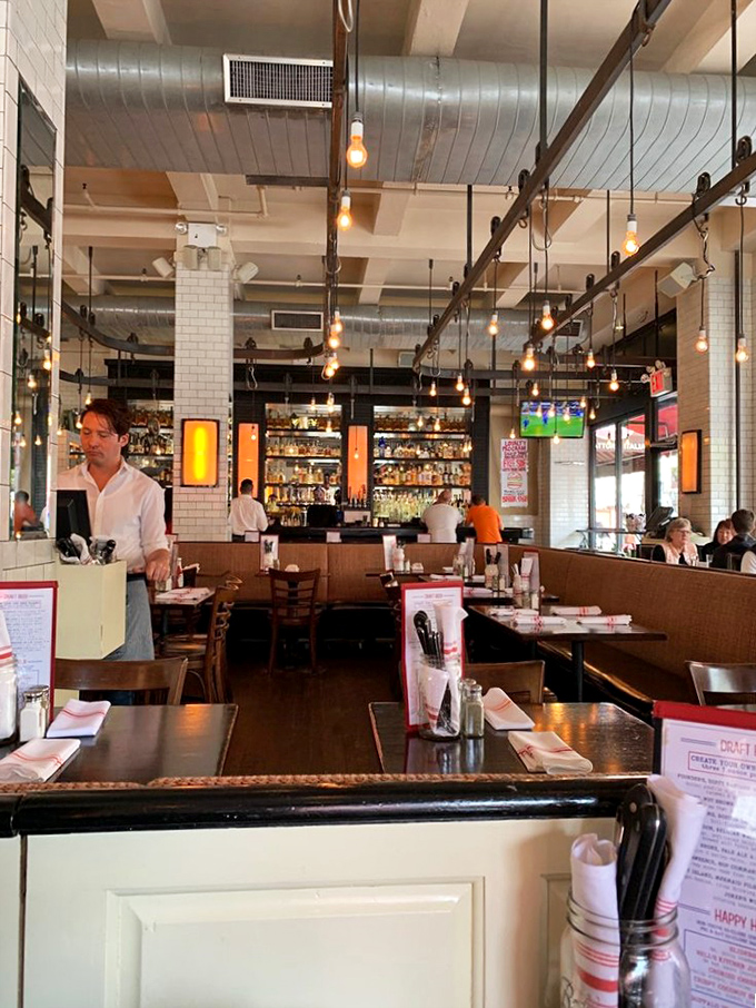 Tables set and ready for the next round of burger enthusiasts. The well-orchestrated dining room awaits its starring role.