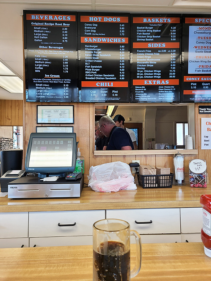 The menu board tells the story: decades of consistency in a world of constant change. Behind that counter, food is prepared with muscle memory and pride.