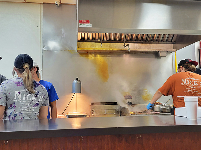The kitchen staff working their magic behind the scenes. That sizzle isn't just noise&mdash;it's the soundtrack of anticipation.