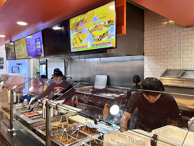 Where the magic happens&mdash;skilled hands crafting each dish with precision while steam rises like delicious ghosts from the cooking surface.