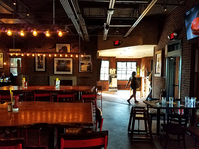 The dining room's warm lighting and exposed brick walls create that rare atmosphere where both first dates and family reunions feel equally at home.