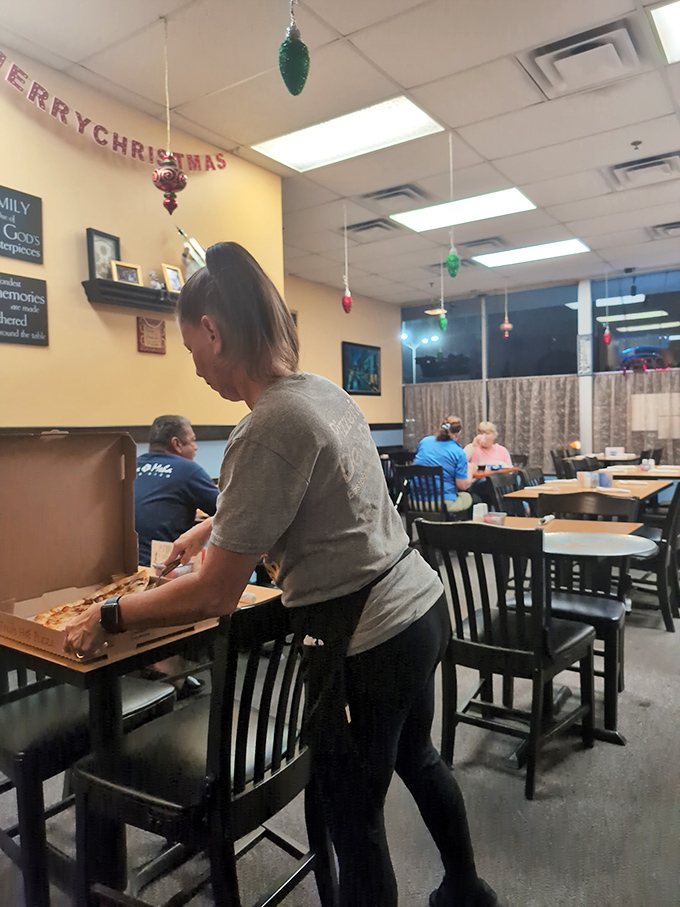 Pizza service in progress. The casual efficiency of someone who knows exactly how many slices make the perfect pie.