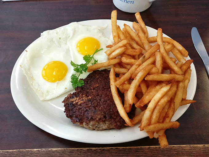 Steak and eggs&mdash;the breakfast of champions, or at least people who plan to champion a nap by noon. Those fries aren't playing a supporting role; they're co-stars.