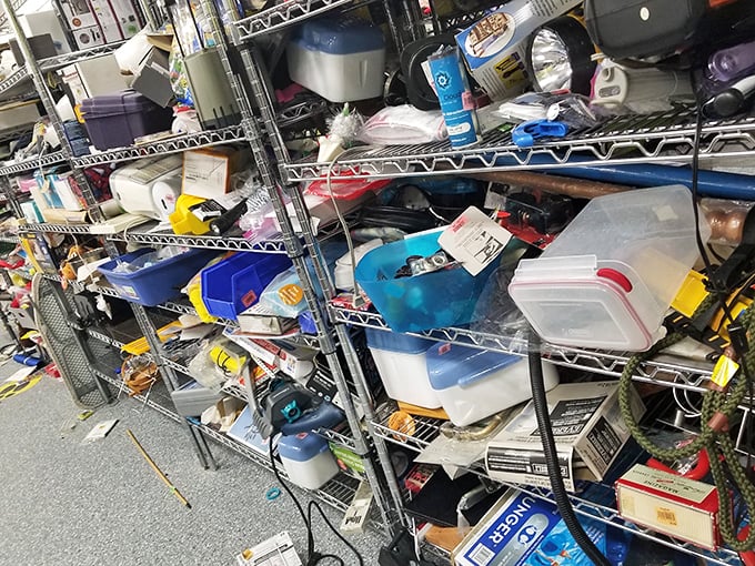 Storage containers and household items create a chaotic still life of American consumerism. One shopper's clutter becomes another's organizational solution.