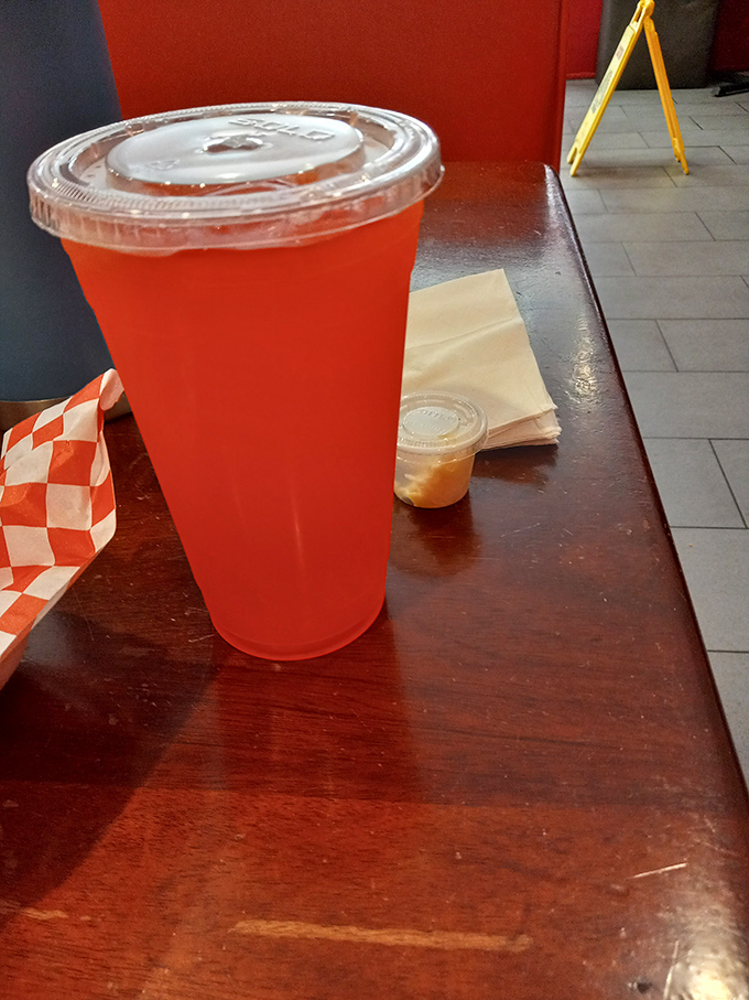 That vibrant red strawberry lemonade isn't just a drink; it's the perfect sweet-tart counterpoint to all that savory fried goodness.