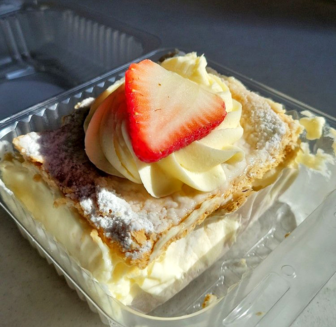 This Napoleon isn't about conquering Europe, but it will definitely conquer your taste buds with layers of pastry, cream, and that perfect strawberry crown.