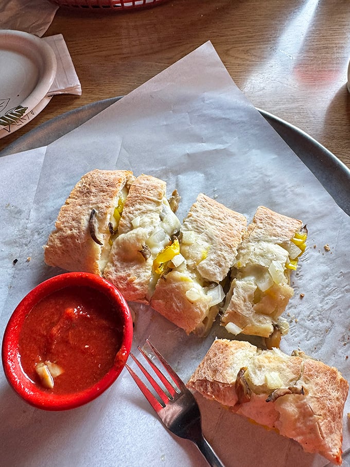 The Stromboli &ndash; pizza's sophisticated cousin who studied abroad. Crispy on the outside, molten goodness within, and that dipping sauce deserves a sonnet.
